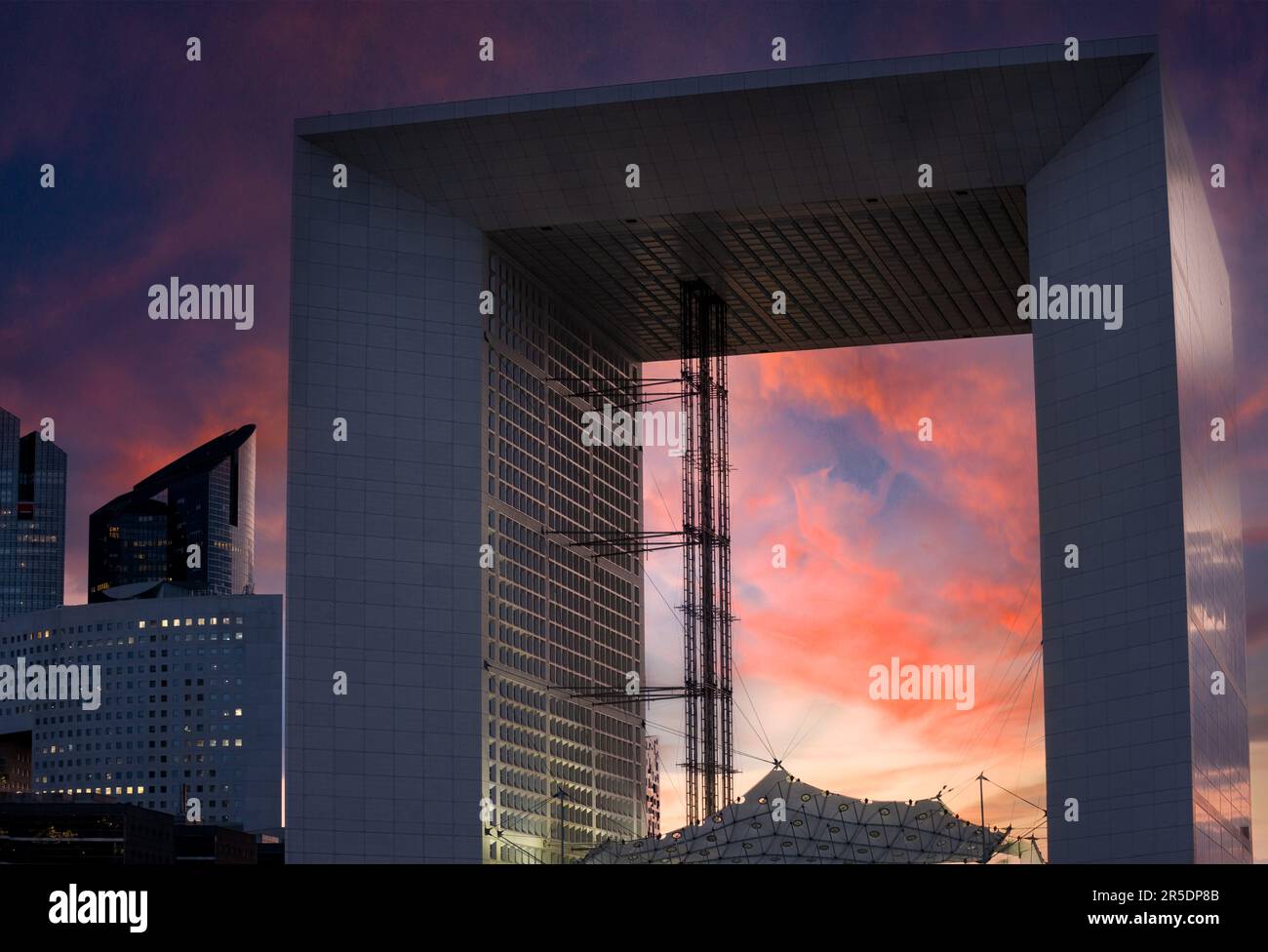 Image of La Defense arch in Paris framing a vivid sunset, lighted ...