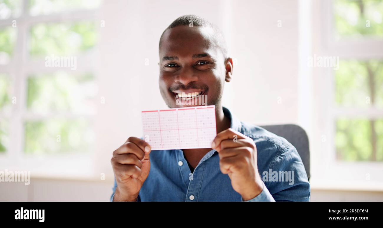 African Lottery Winner Person With Lotto Ticket Stock Photo - Alamy