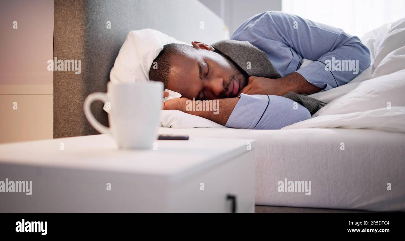 Sick Man Sleeping In Bed To Rest Stock Photo - Alamy