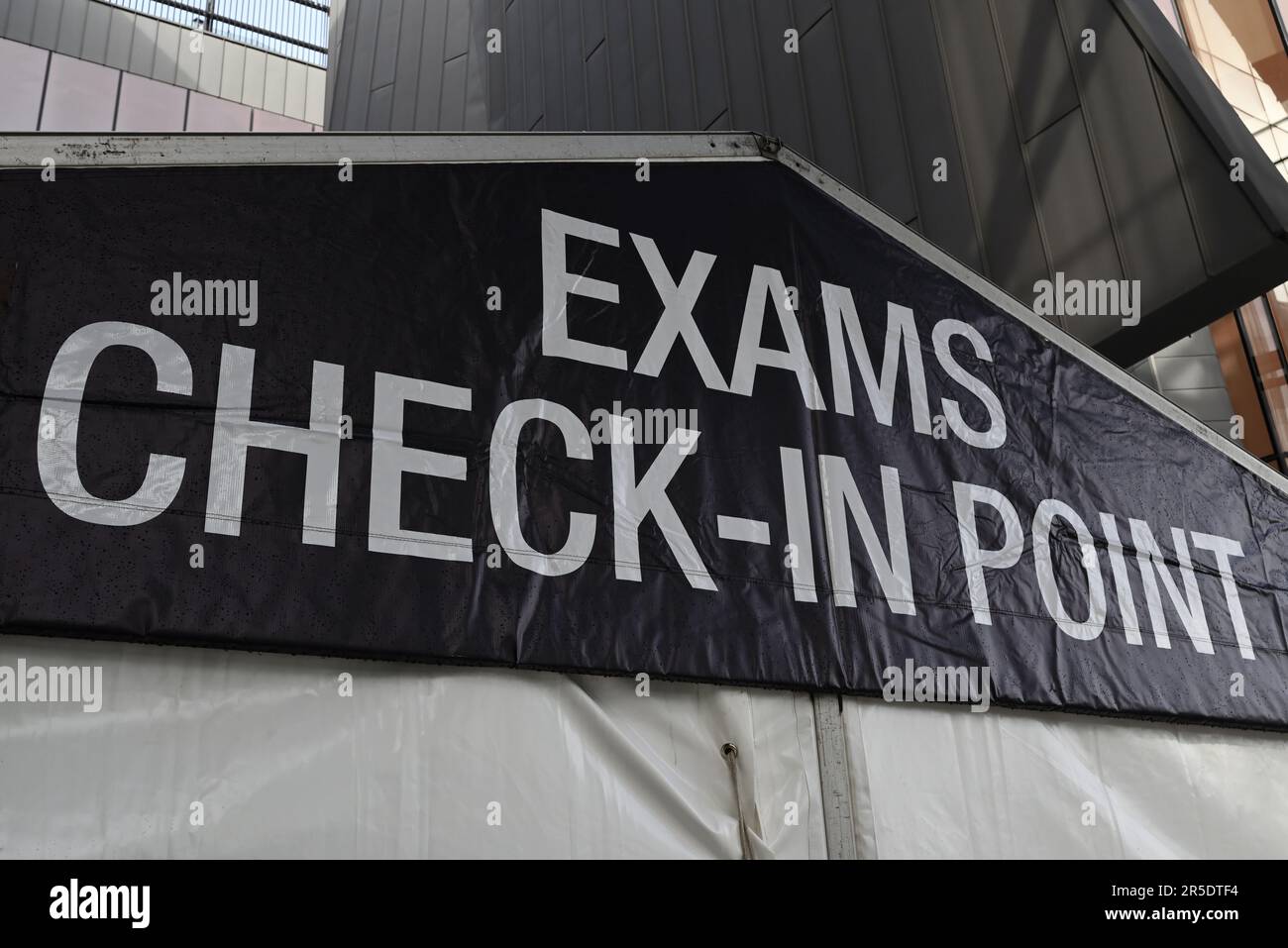 Black and white exam check-in point sign outside the Learning and ...