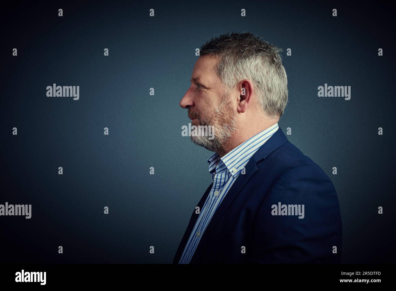 Hes got an impressive business profile. Studio profile of a confident ...