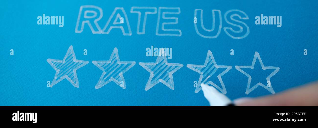 Person leaving feedback on servants and drawing star Stock Photo - Alamy