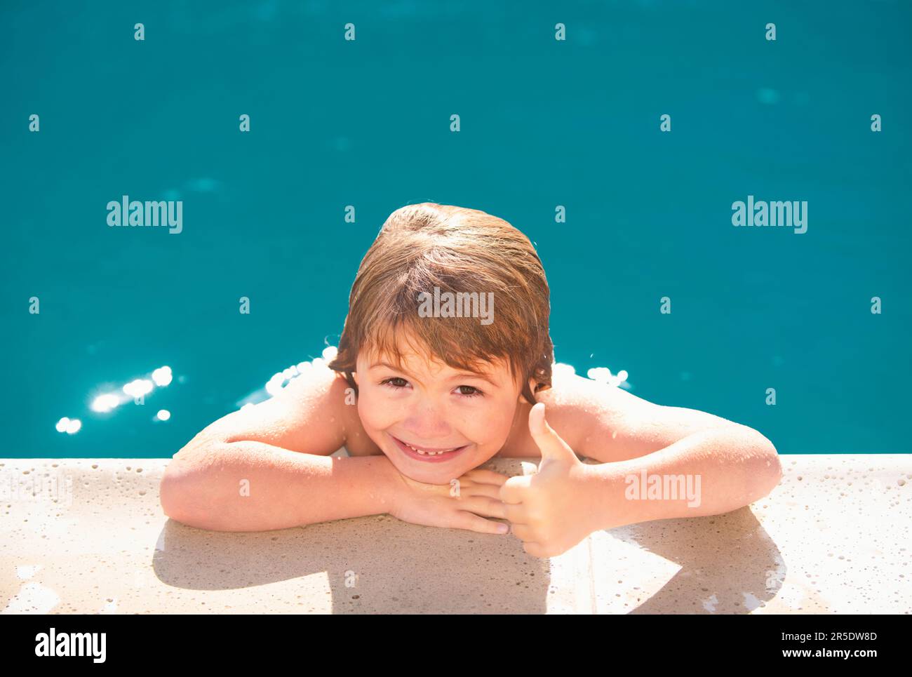 Kids in swimming pool portrait, thumbs up. Kids summer activities Stock ...