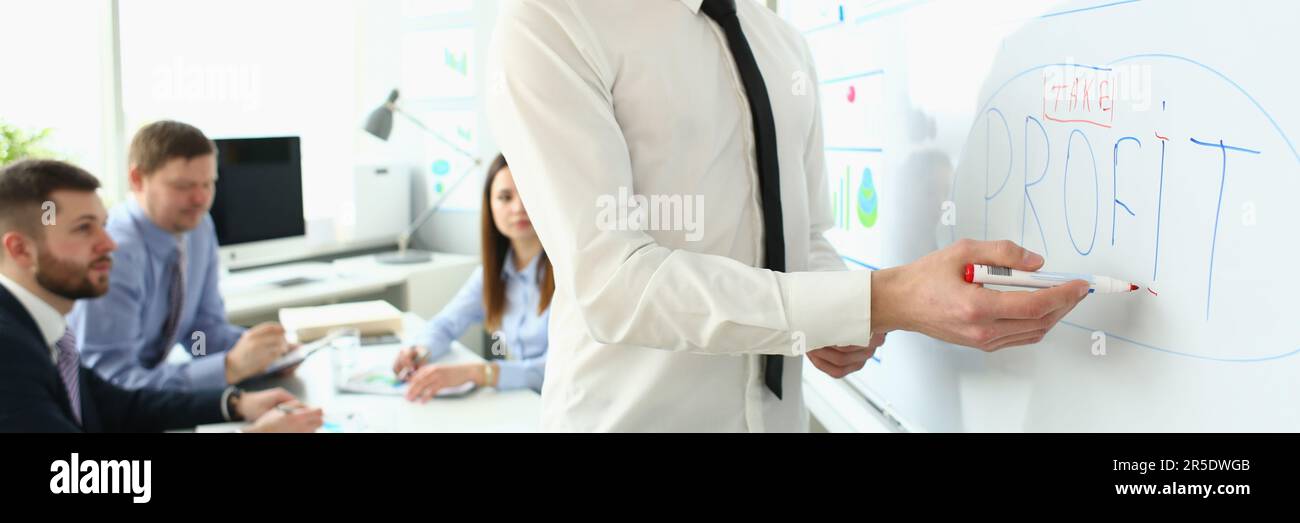 Confident business coach make presentation and profits in a business to ...