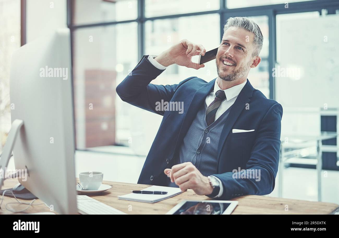 Making smart corporate connections. a mature businessman using a ...