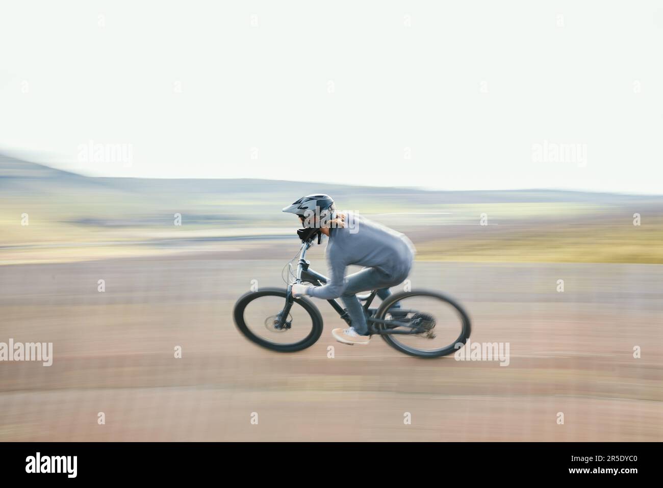 Adrenaline, blur and athlete riding a motorcycle in nature training for ...