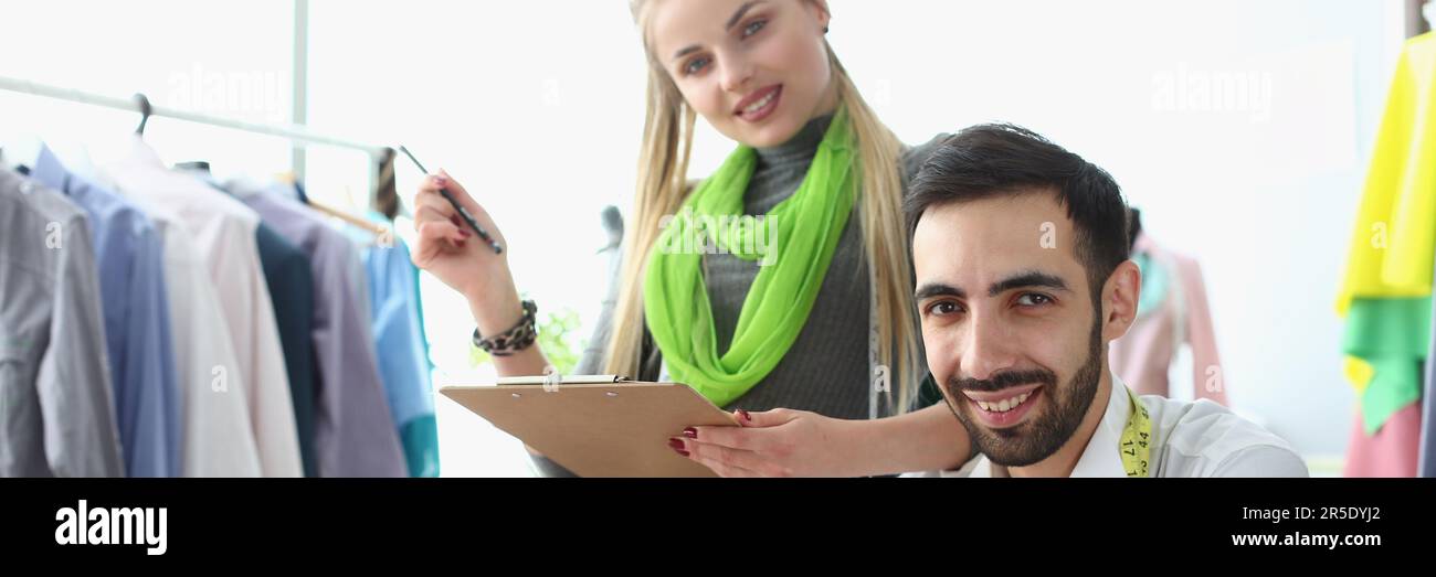 Team of fashion designer creates new collection of clothes in atelier ...