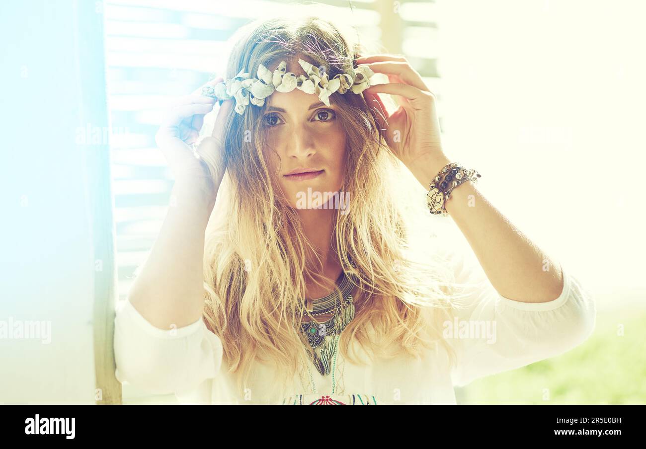 Adorned with beauty from nature. an attractive young woman wearing a ...