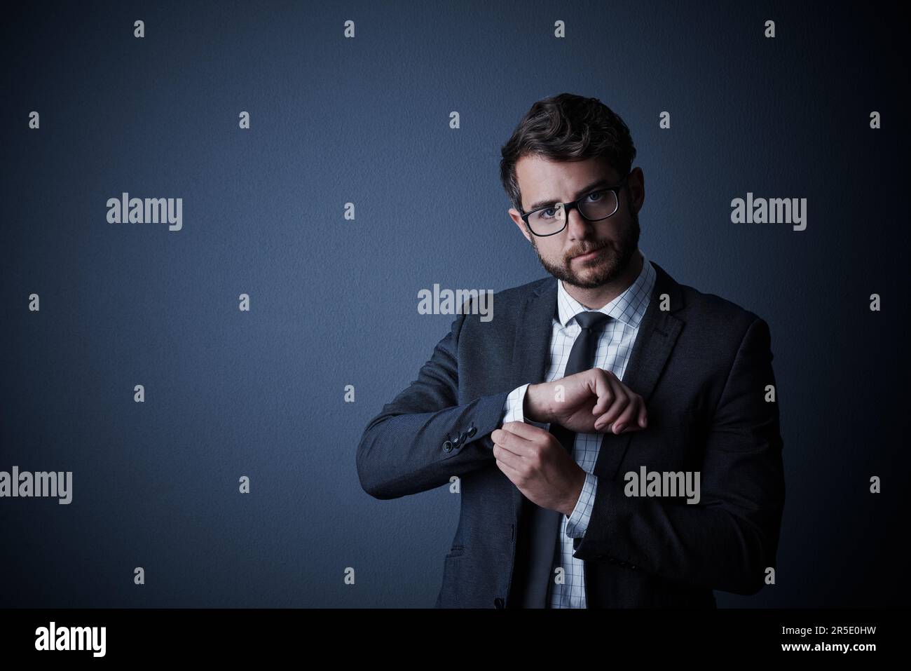 Businessman adjusting cuffs hi-res stock photography and images - Alamy