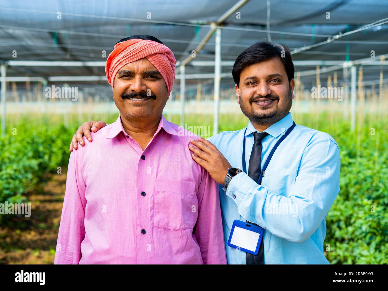 Happy smiling indian supportive banker with Indian farmer standing at ...