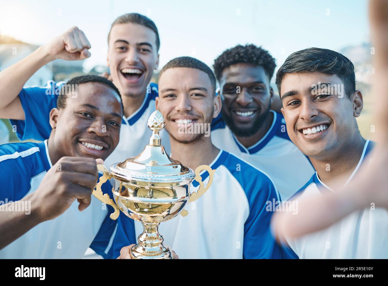 Sports group, soccer trophy and selfie of team on field for game award ...