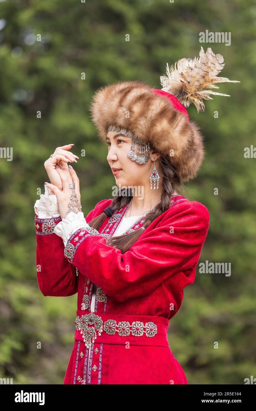 Traditional dress. Woman in Ala-Archa National Park. Kyrgyzstan Stock Photo - Alamy