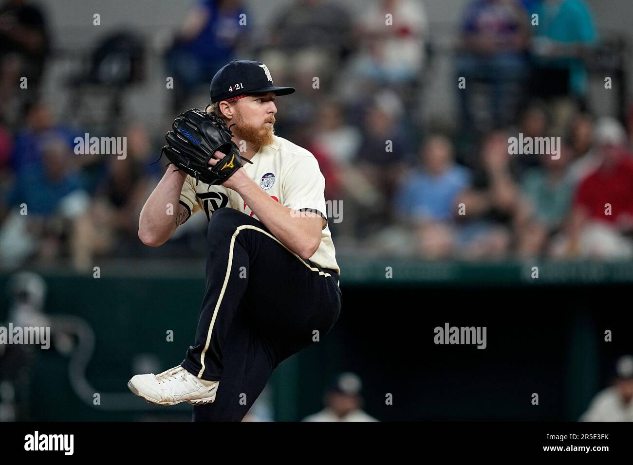 Texas Rangers starting pitcher Jon Gray winds up to throw to the ...
