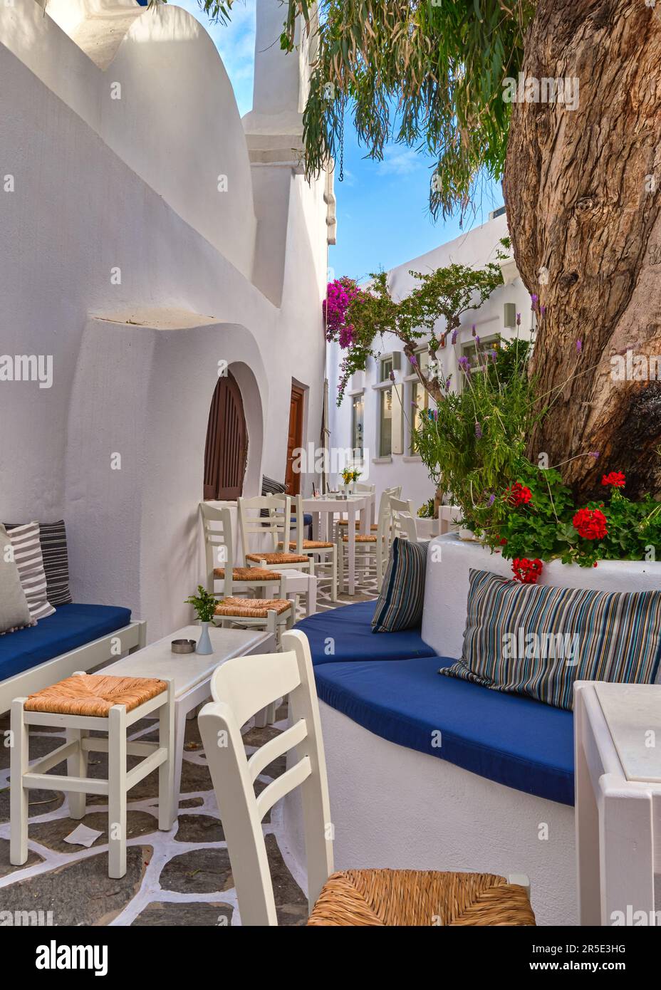 Cozy outdoor cafe or bar in Greek traditional town, Aegean island ...