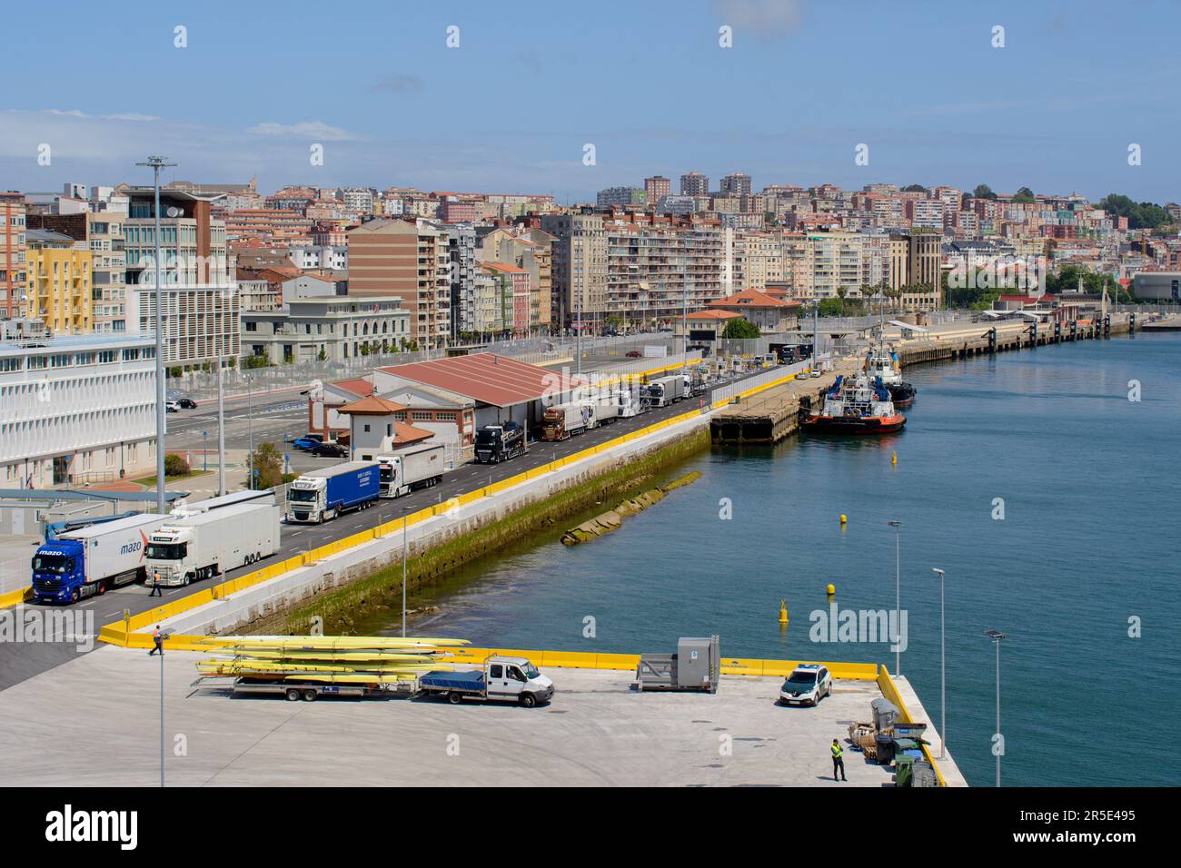 Santander harbour, Spain. Lorries queuing along sea front waiting to ...