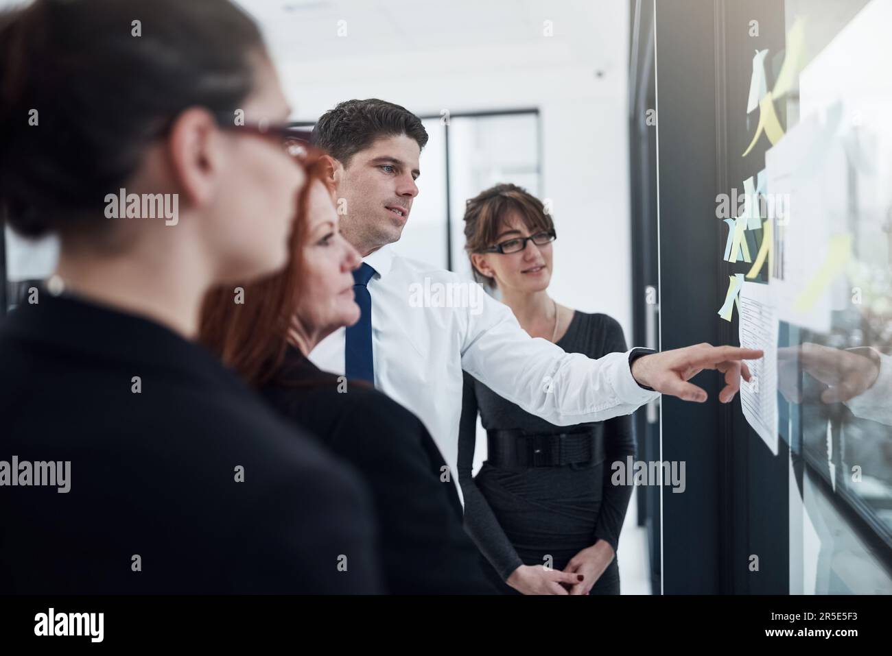 We need to priorities this task. a group of businesspeople ...