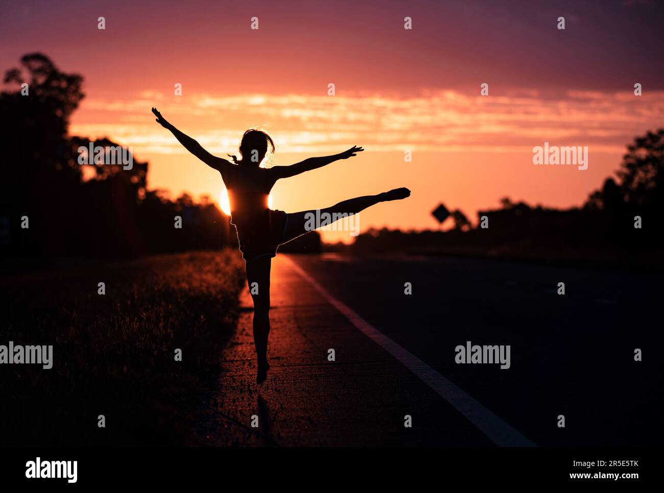 Young woman dancing in summer sunset sky outdoor. People freedom Stock ...