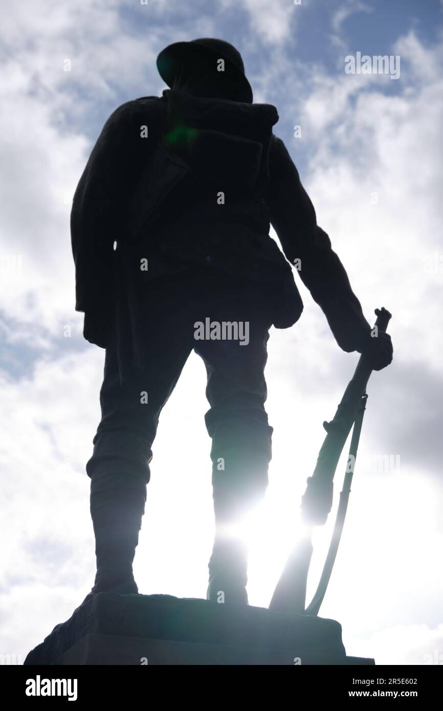 Low-angle angle view of a remembrance day statue of a British soldier ...