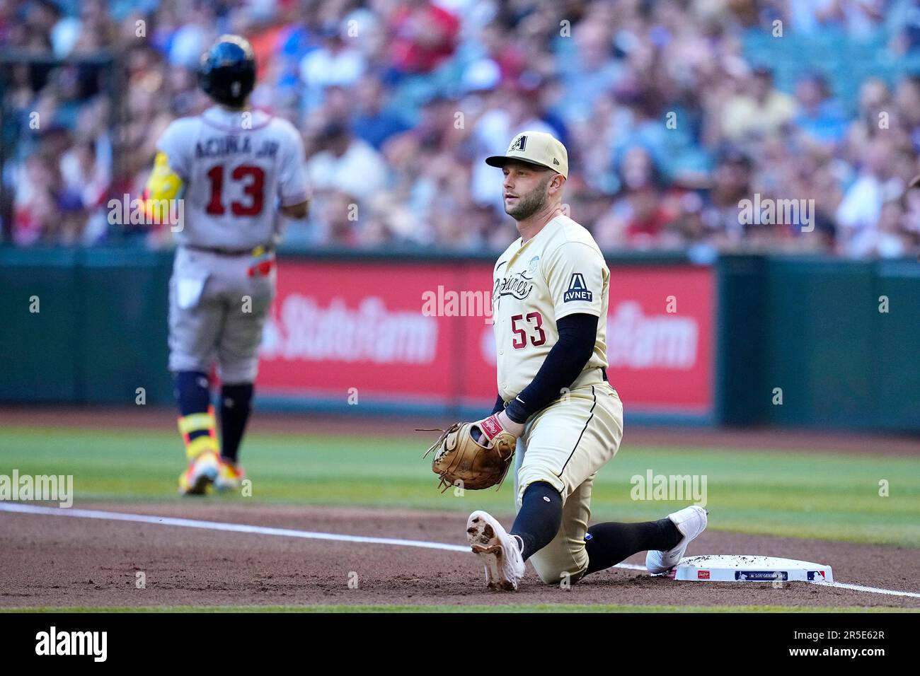 Atlanta Braves' Ronald Acuna Jr. (13) beats out an infield hit as ...