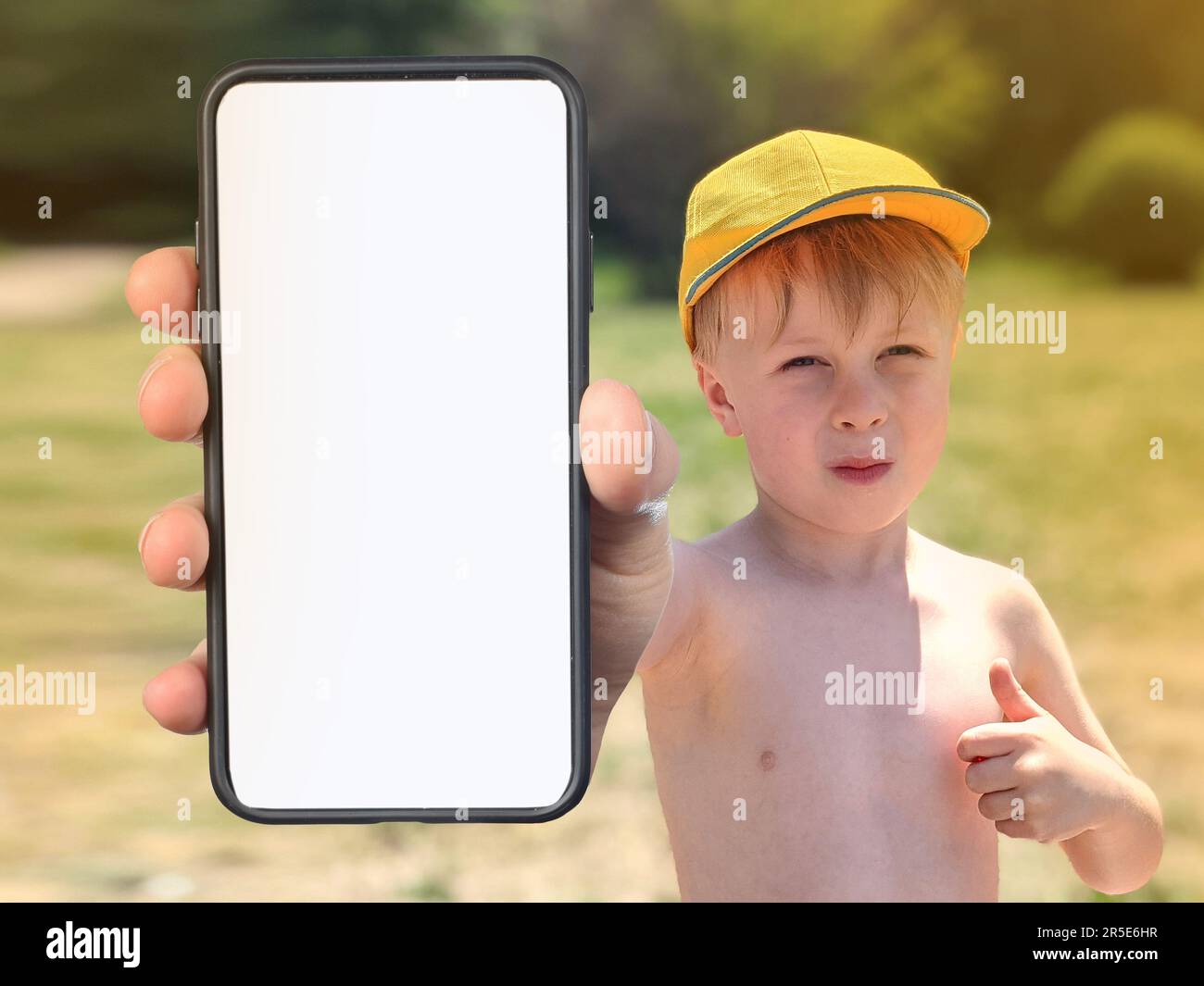 cute boy child shows smartphone with blank white screen Stock Photo - Alamy