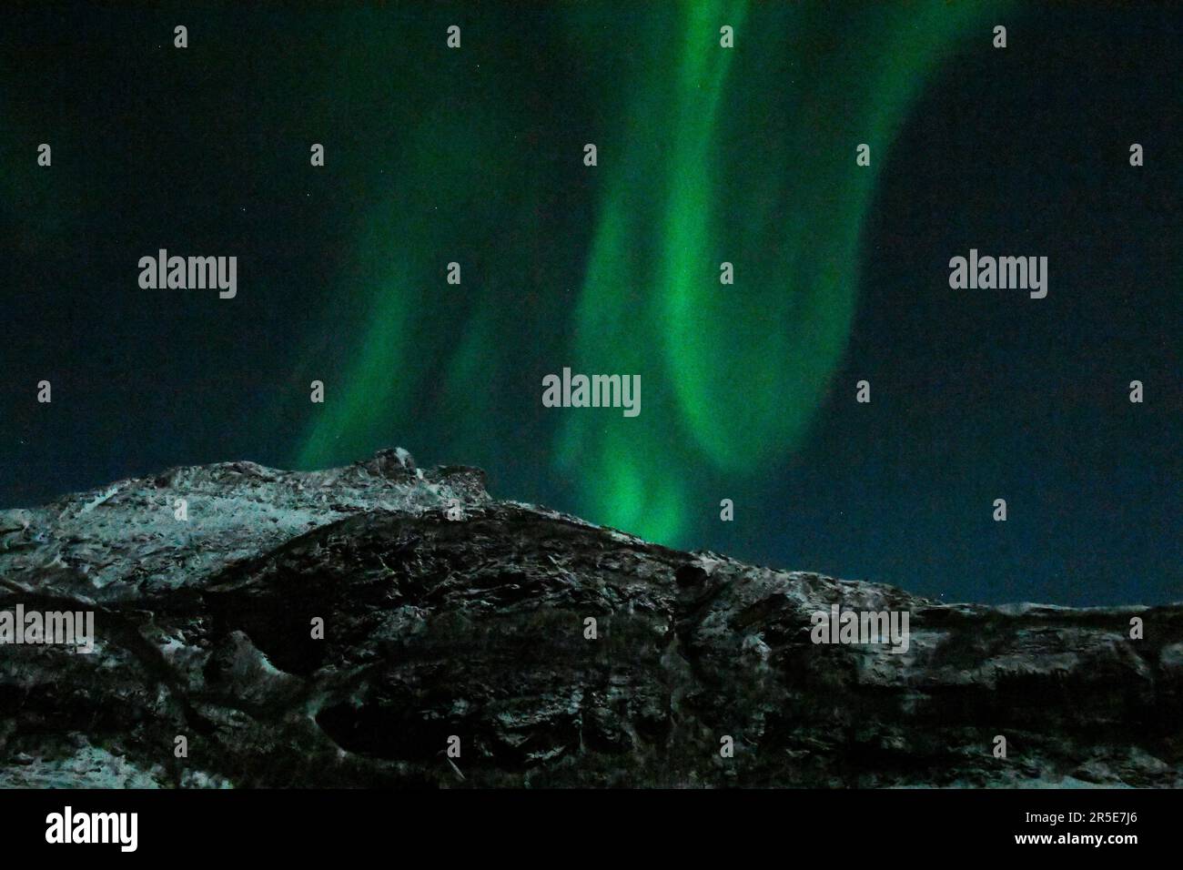 Bright Green Colours of the Northern Light, Aurora Borealis illuminate ...