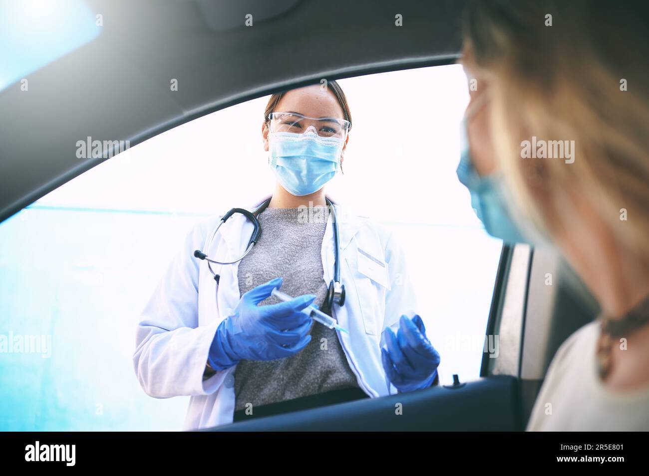 Give safety your best shot. a masked young doctor giving a patient an ...