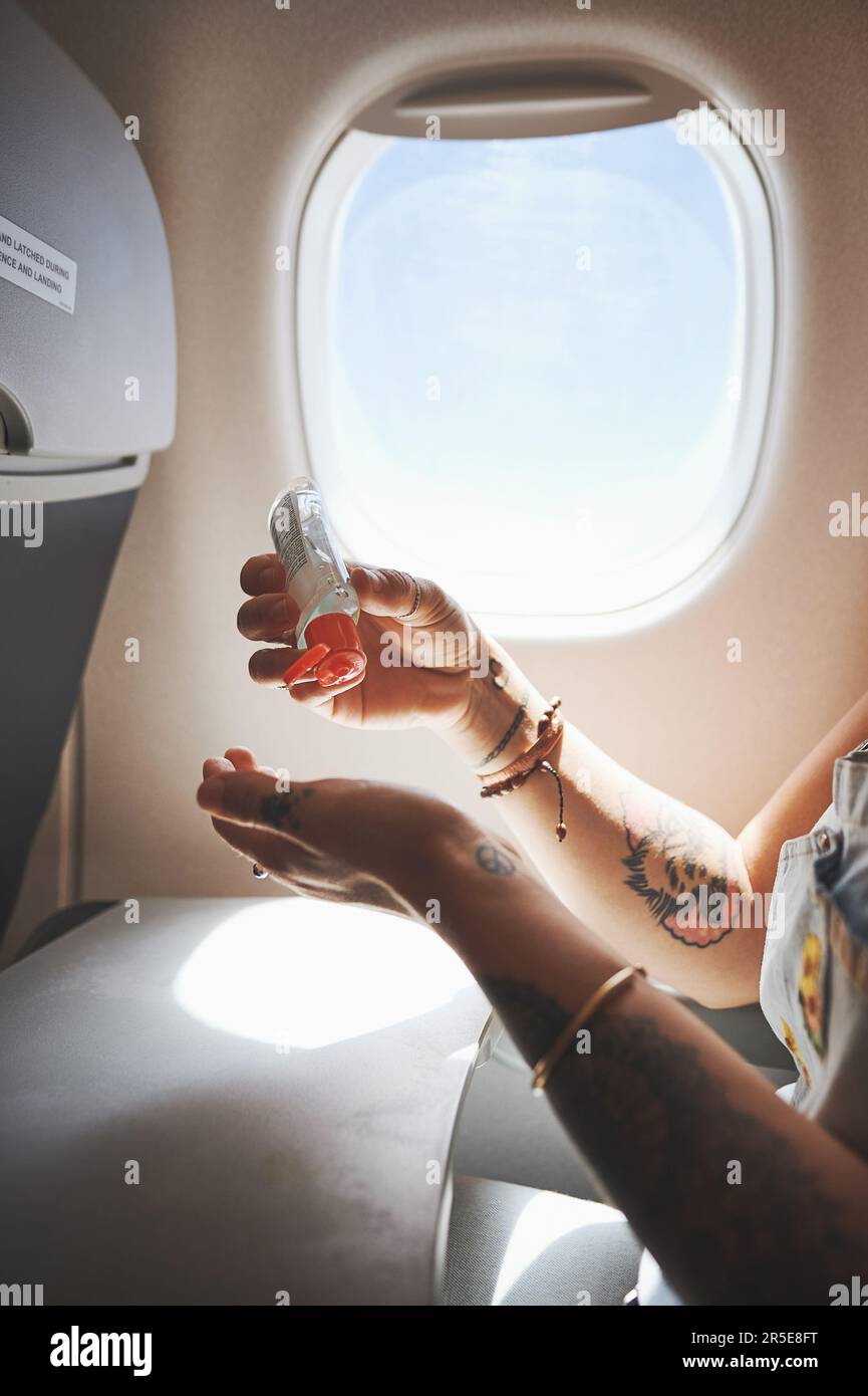 Protect yourself and others. a woman sanitising her hands in the ...