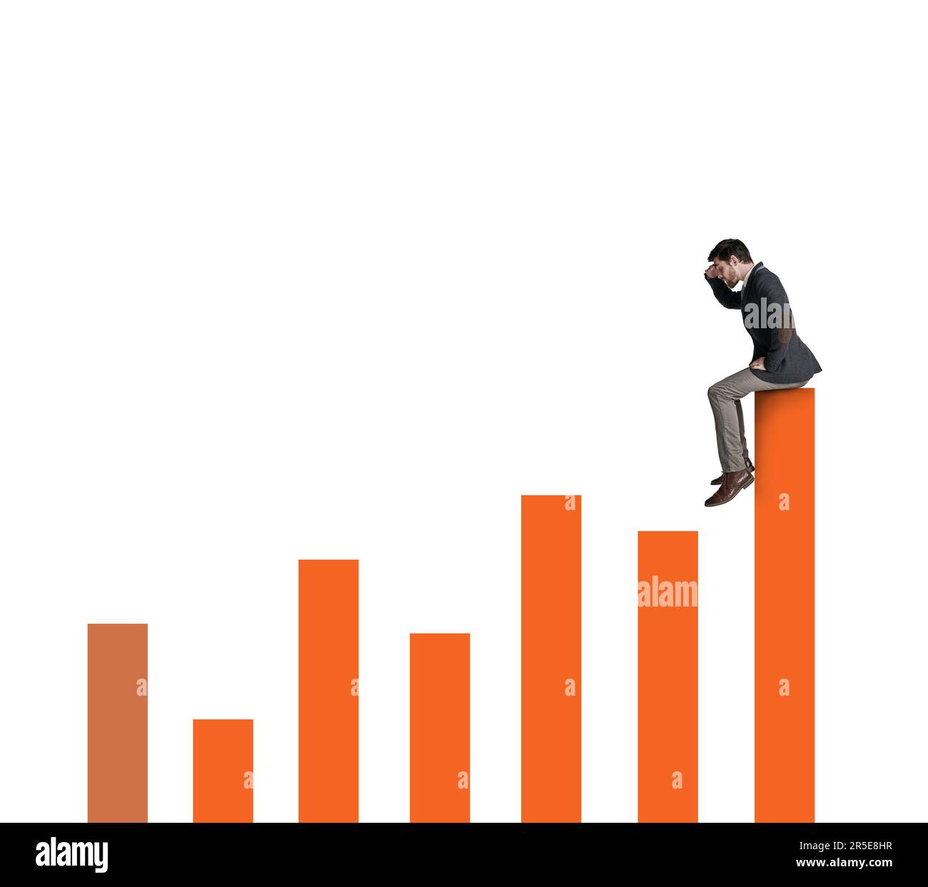 Take your position at the top. a businessman balancing on top of a ...