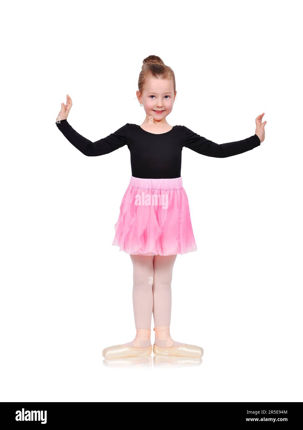 little ballerina standing on white floor Stock Photo - Alamy
