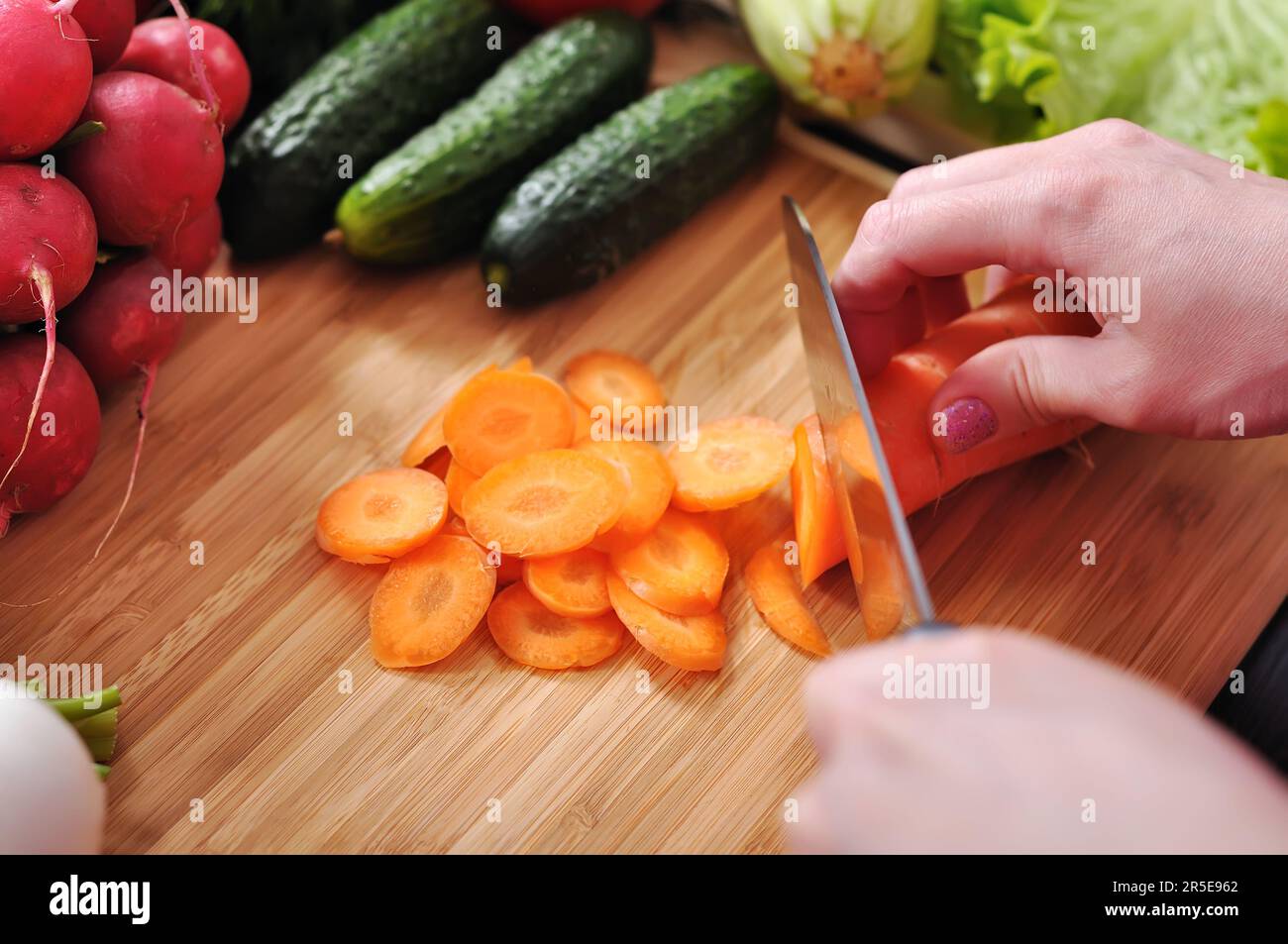 Hand knife cuts carrot hi-res stock photography and images - Alamy
