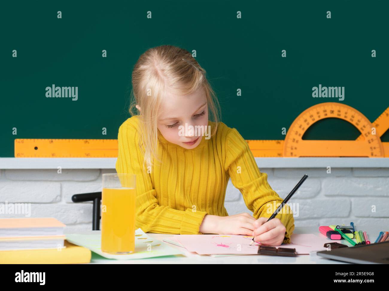Portrait of funny pupil girl of primary school study. Genius child ...