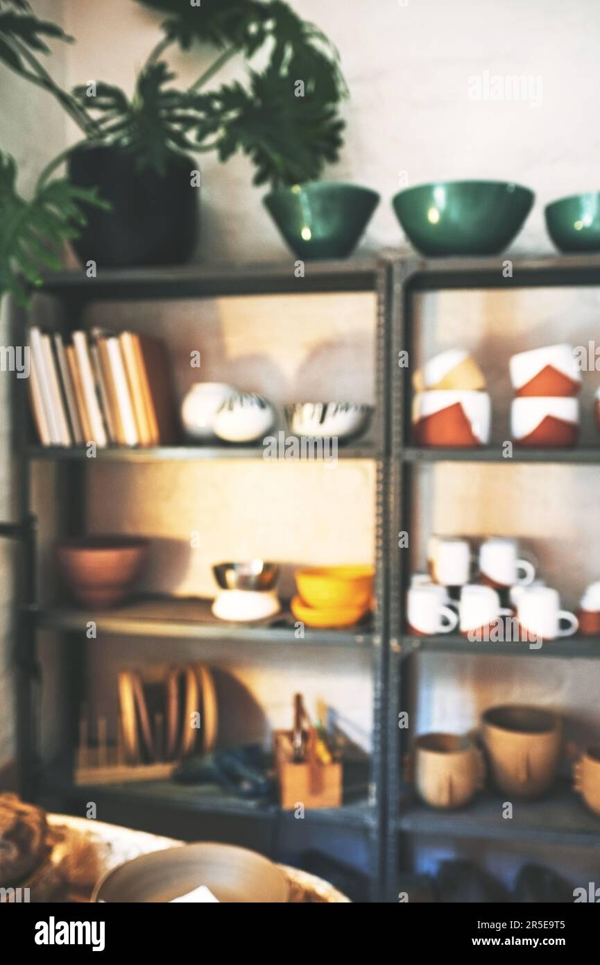 Take your pick of pottery. various pottery crafts on a shelf in an ...