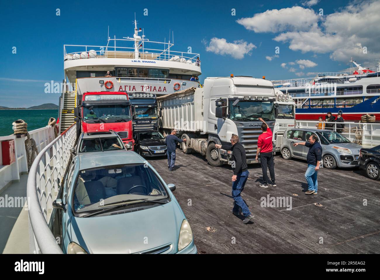 Vehicles boarding with very little space left, Agia Triada ferry ...