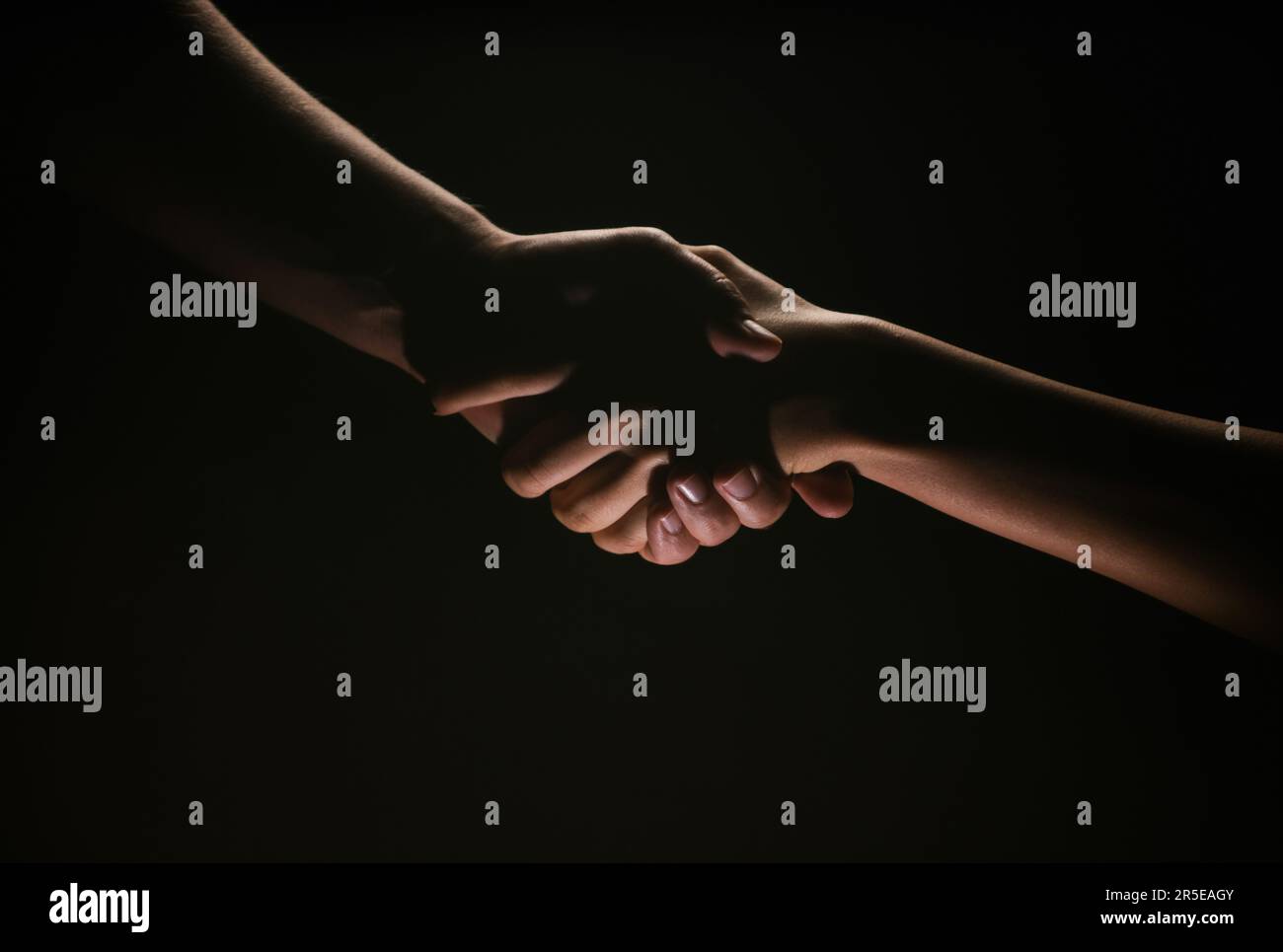 Handshake hand, arm on salvation. Close up help hand. Two hands ... Handshake hand, arm on salvation. Close up help hand. Two hands ...
