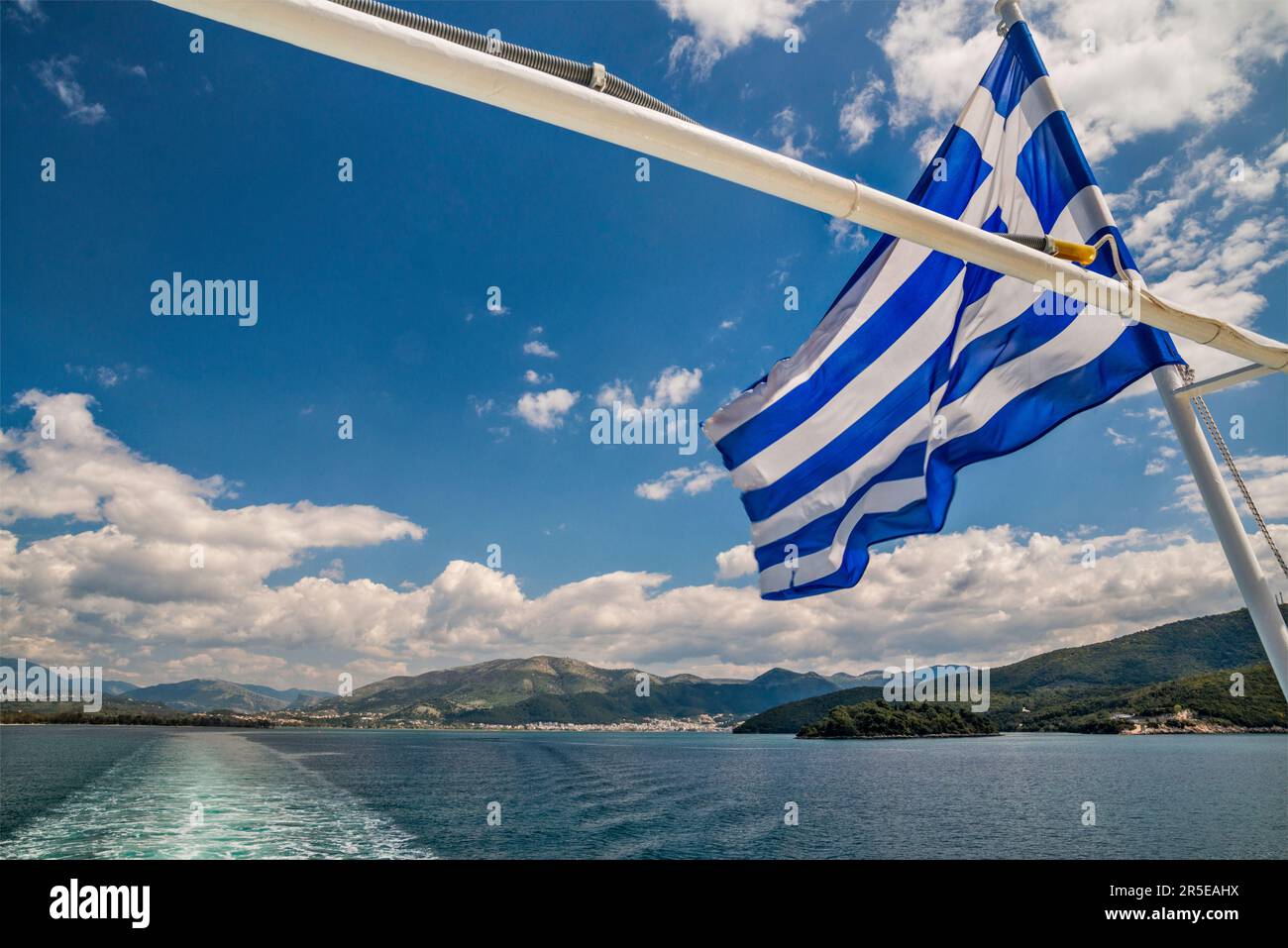 Greek flag, vessel wake, stern of Agia Triada ferry, Lefkimmi Lines ...