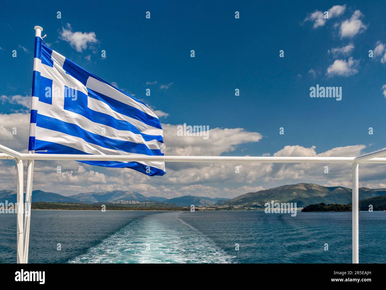 Greek flag, vessel wake, stern of Agia Triada ferry, Lefkimmi Lines ...