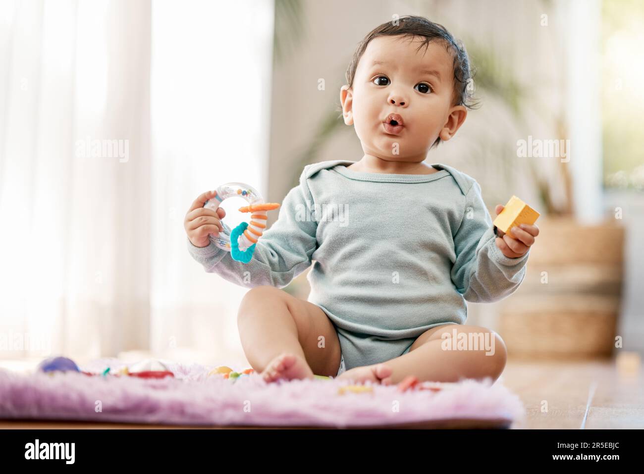 Surprised baby playing on hi-res stock photography and images - Alamy