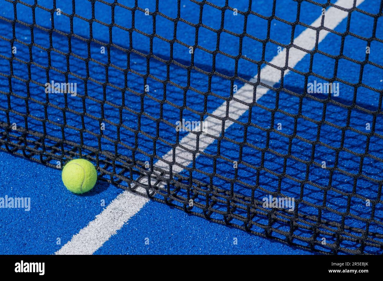 Net of a blue paddle tennis court Stock Photo - Alamy