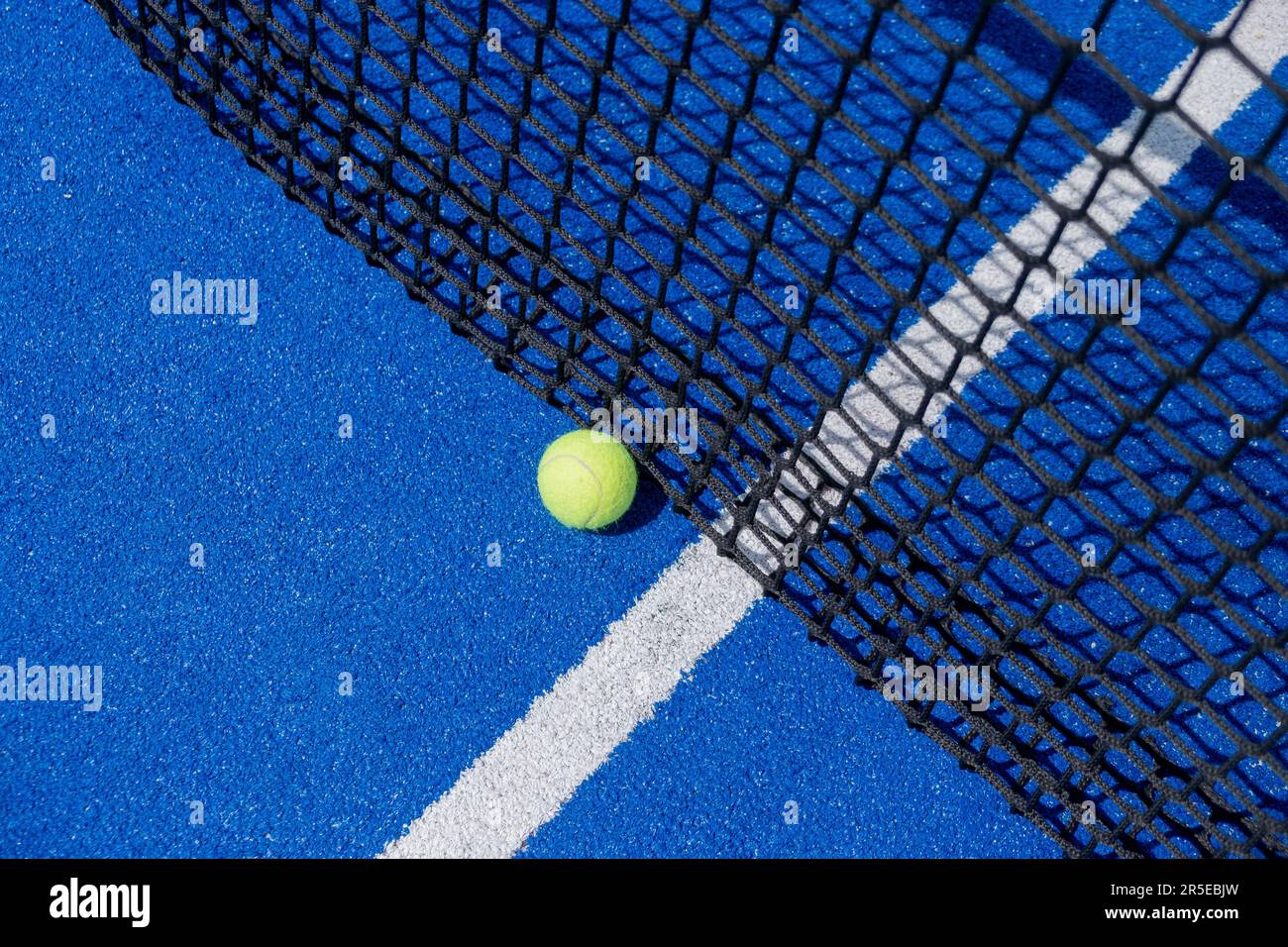 Blue paddle tennis court net Stock Photo - Alamy