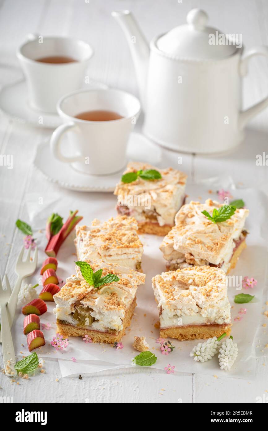 Tasty rhubarb yeast cake with foam and crumble. Mold cake with rhubarb ...