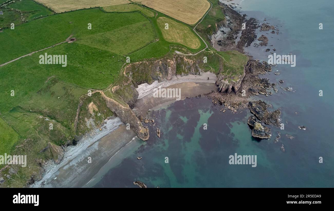 large beach with rock formations from a cliff. Tra na mBóBeach. Cooper ...