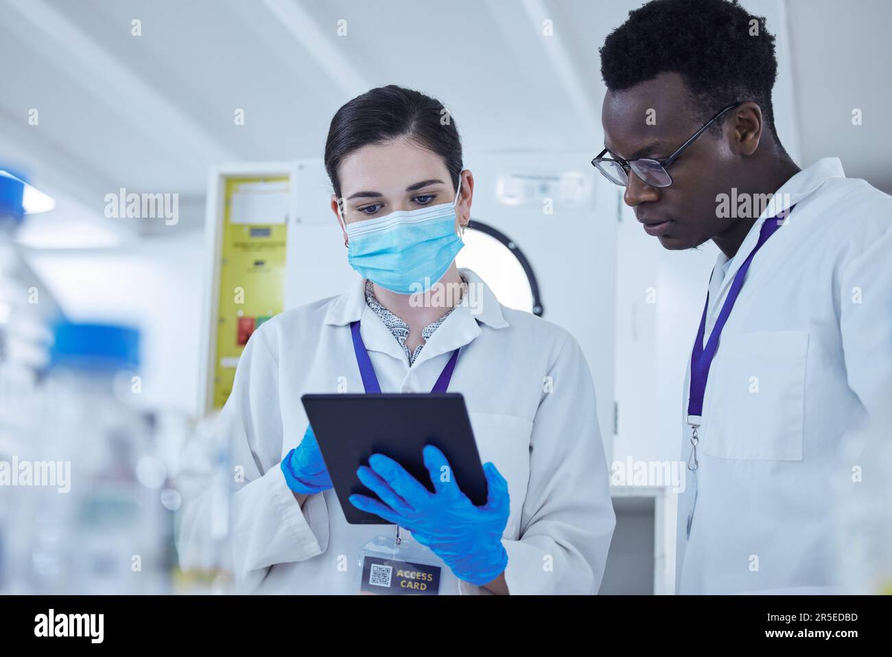 Science, staff and man with woman, tablet and connection in a ...