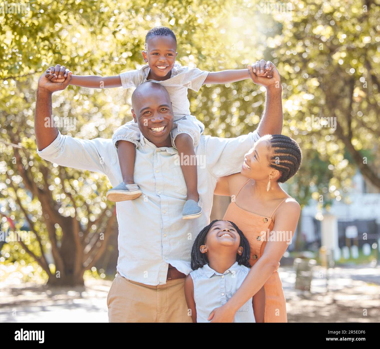 Portrait, mother or father with happy kids in park to relax with smile ...