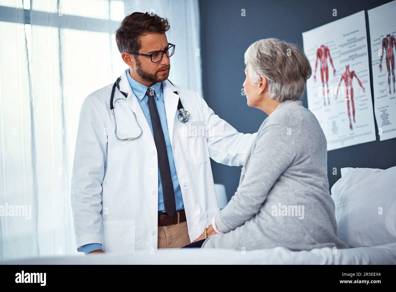 In for her routine examination. a doctor examining a senior patient in ...