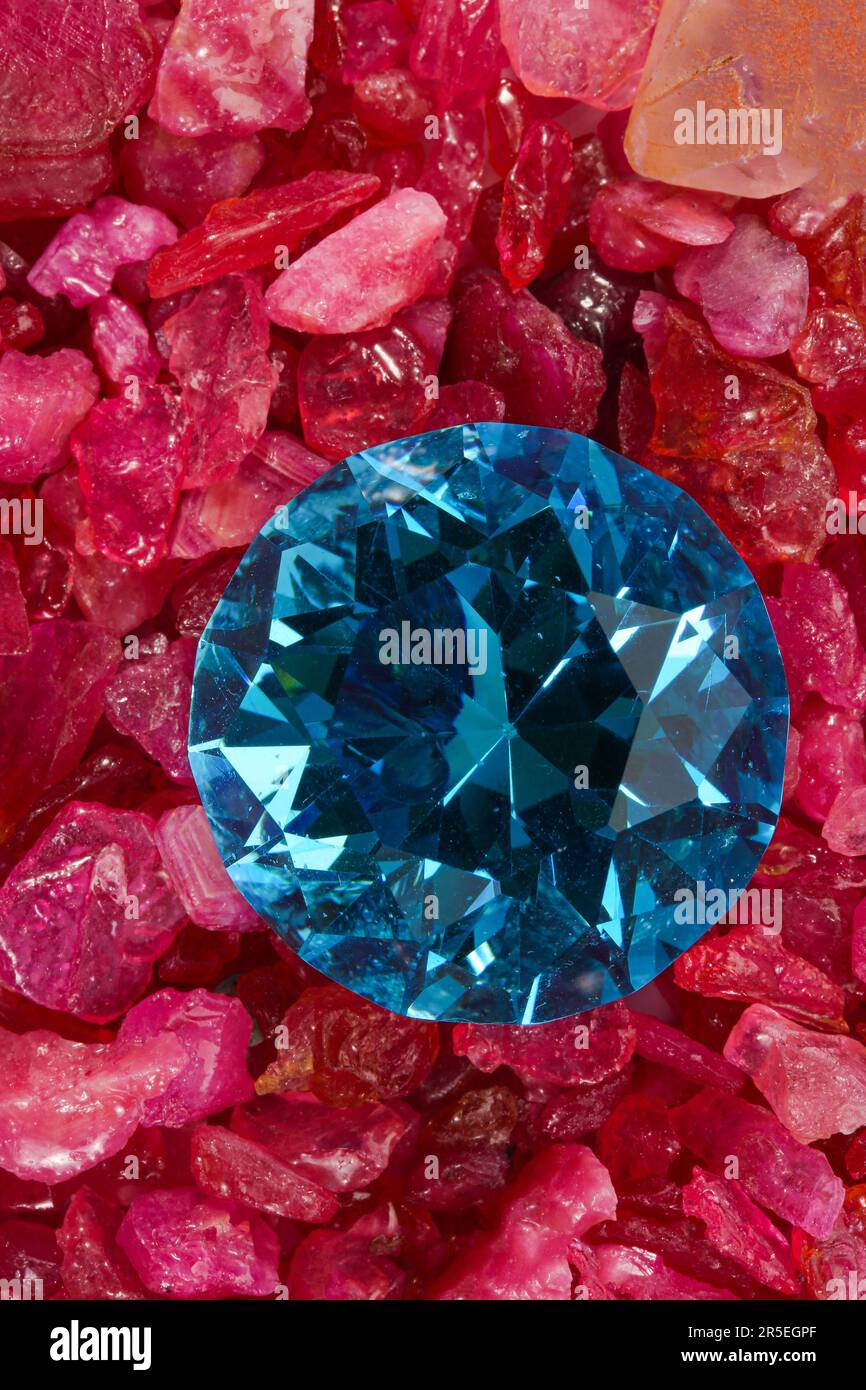 Blue diamond on placed on a pile of raw granit gemstones Stock Photo ...
