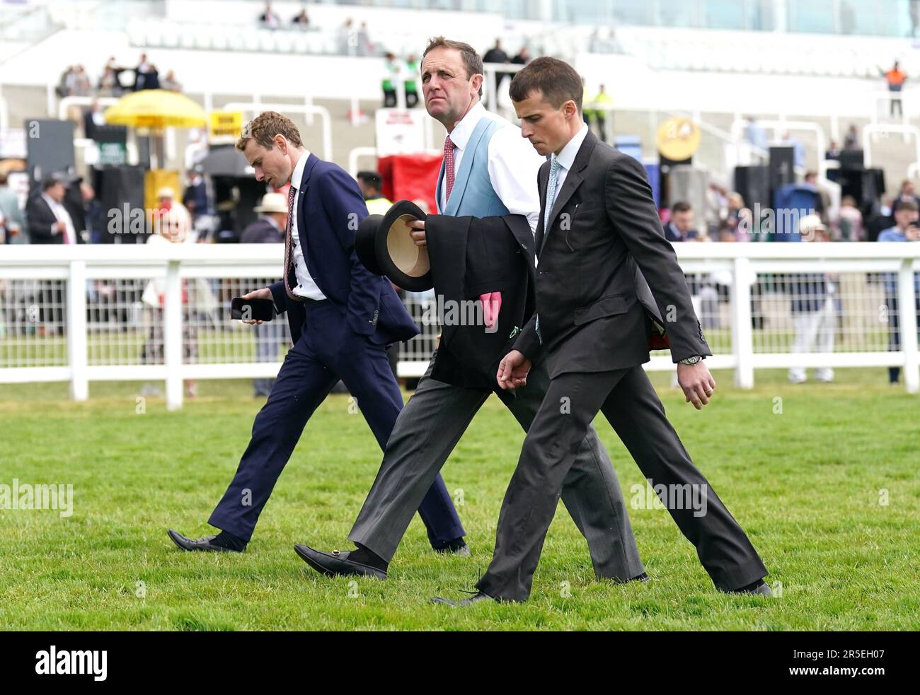 Horse trainer Charlie Appleby (centre) with jockeys Ryan Moore (left ...