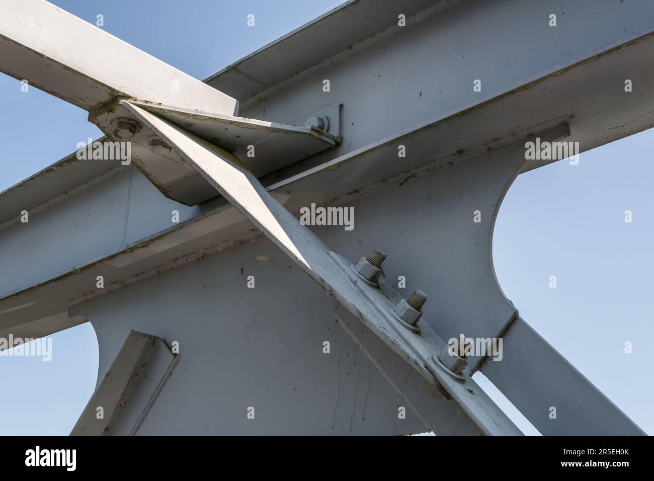 Bolts and nuts on metal plates of steel structure of heavy duty ...