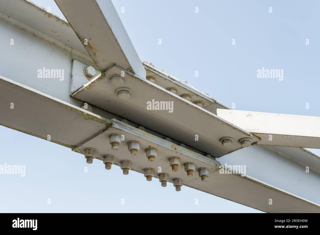 Bolts and nuts on metal plates of steel structure of heavy duty ...