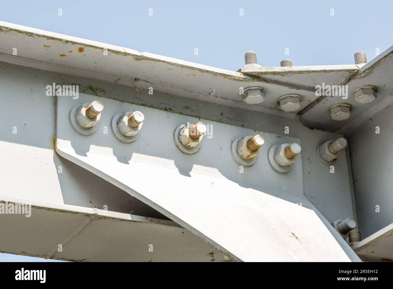 Bolts and nuts on metal plates of steel structure of heavy duty ...