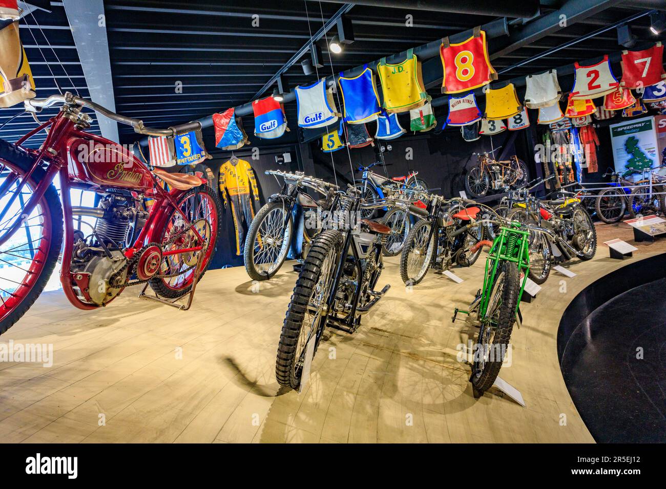 A selection of British Speedway bikes on a banked display and rider's ...